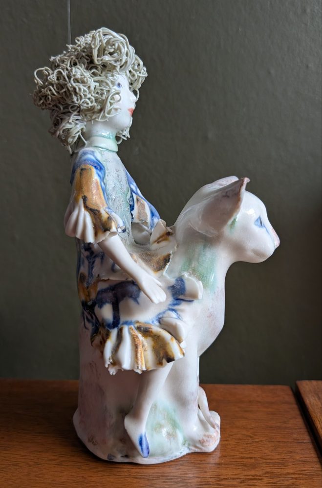 Porcelain figurine of woman riding a giant cat by Gillian Still b.1939 ...