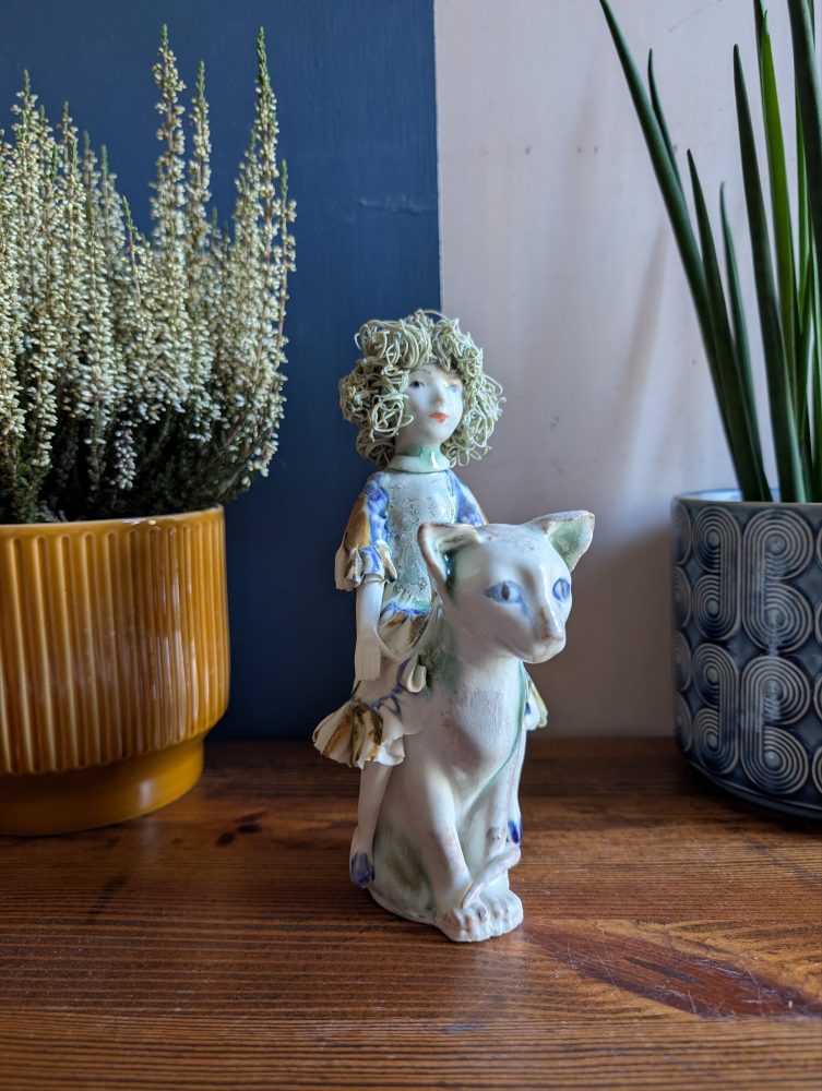 Porcelain figurine of woman riding a giant cat by Gillian Still b.1939 ...
